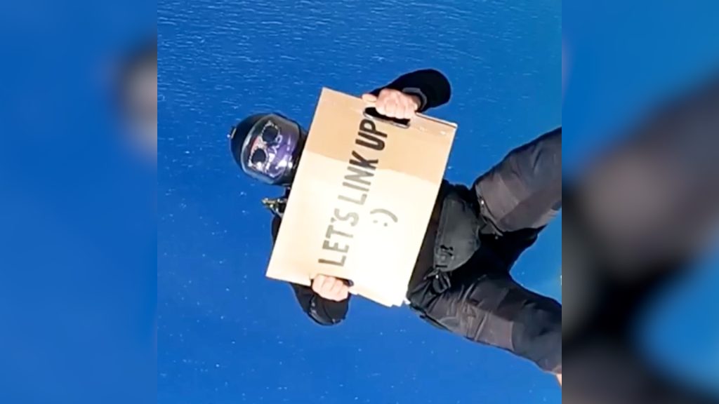 Man Lands dream Job After Jumping Out Of Plane With Sign Asking For ...